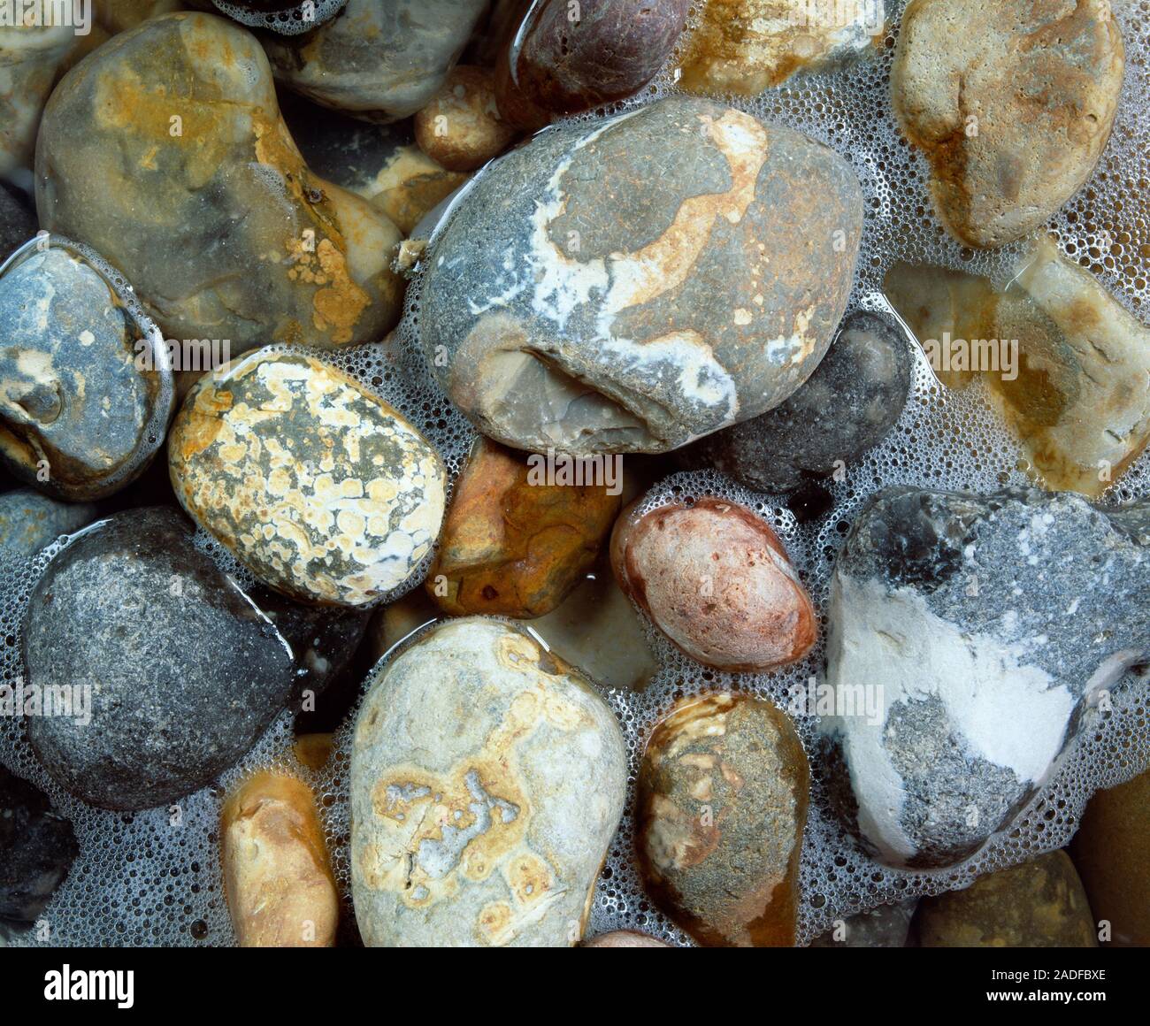 Pebbles under water. Water erosion and the action of these pebbles ...