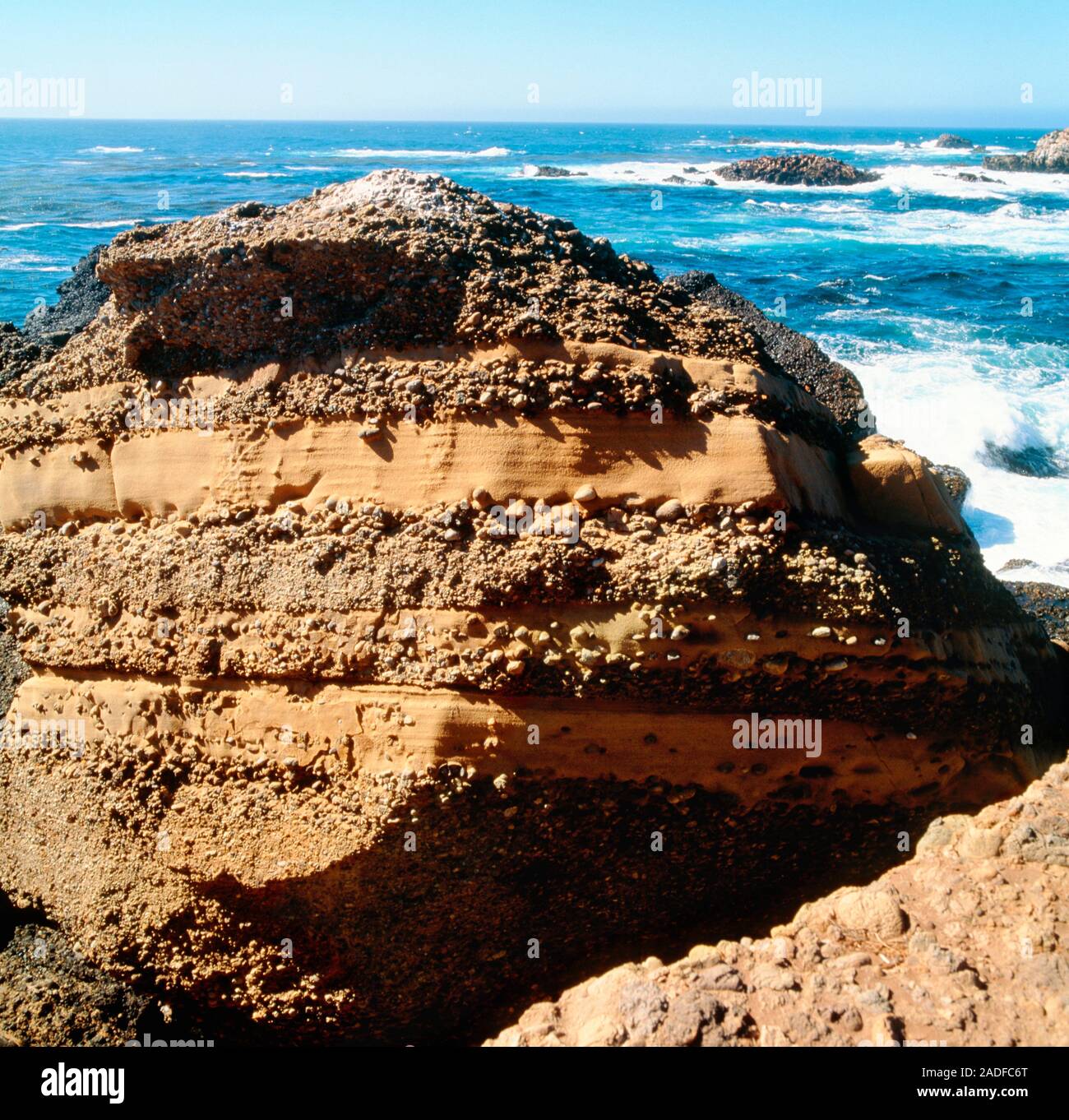 Sedimentary rock coastal erosion. View of the unusual strata on a ...