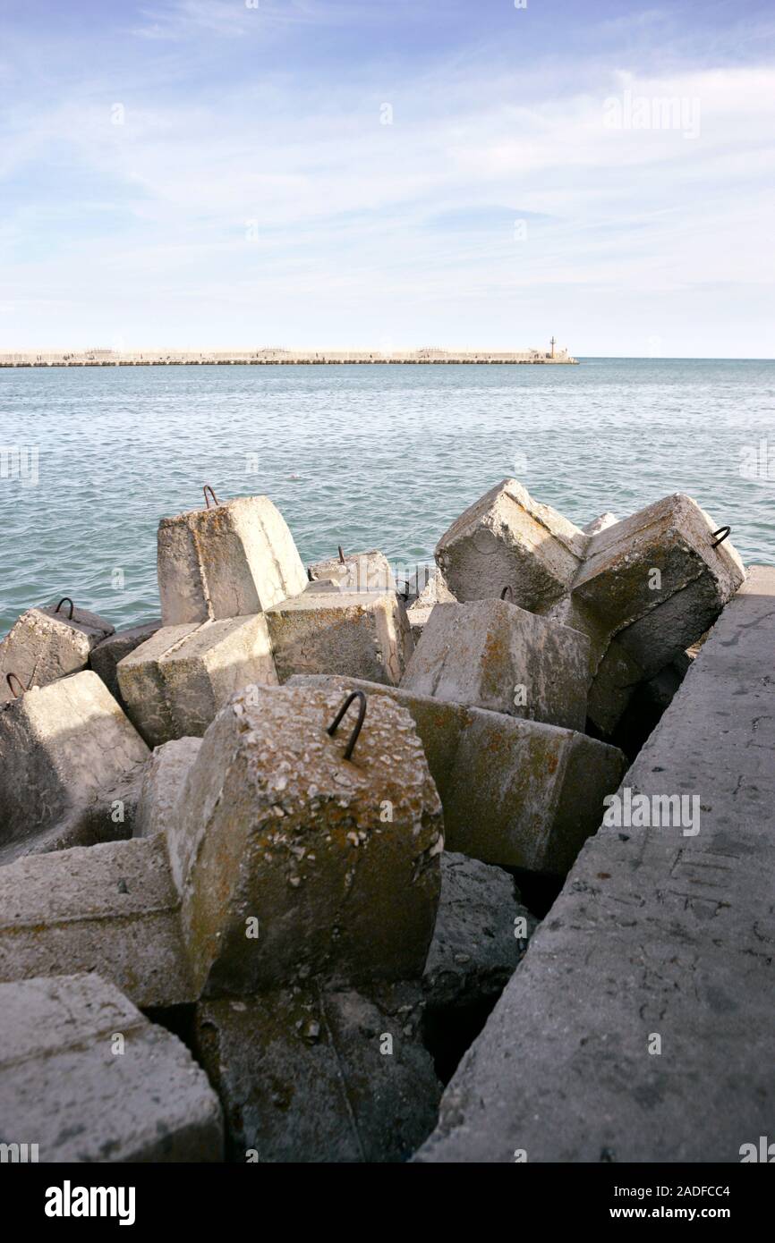 Coastal defence. Precast concrete blocks at a harbour. This type of sea ...