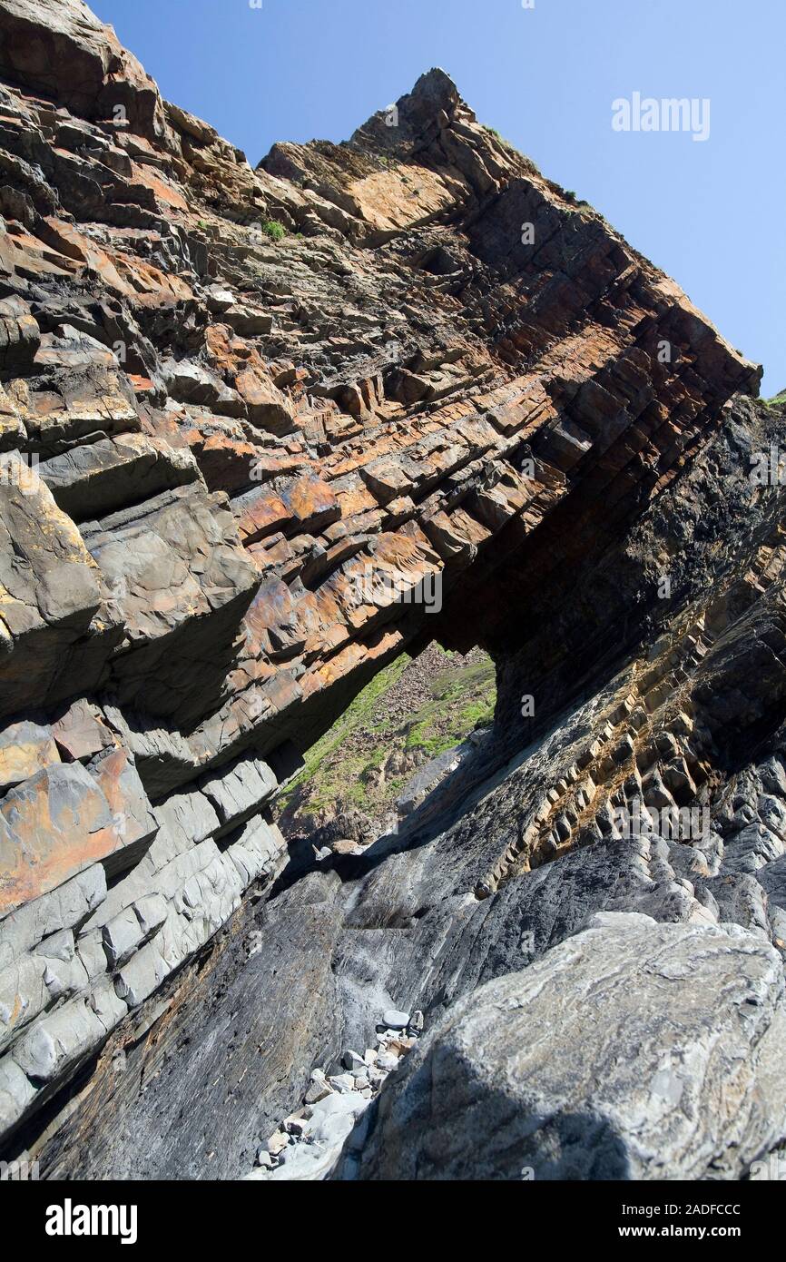 Coastal erosion. Heavily eroded sedimentary rock cliff, called Window ...