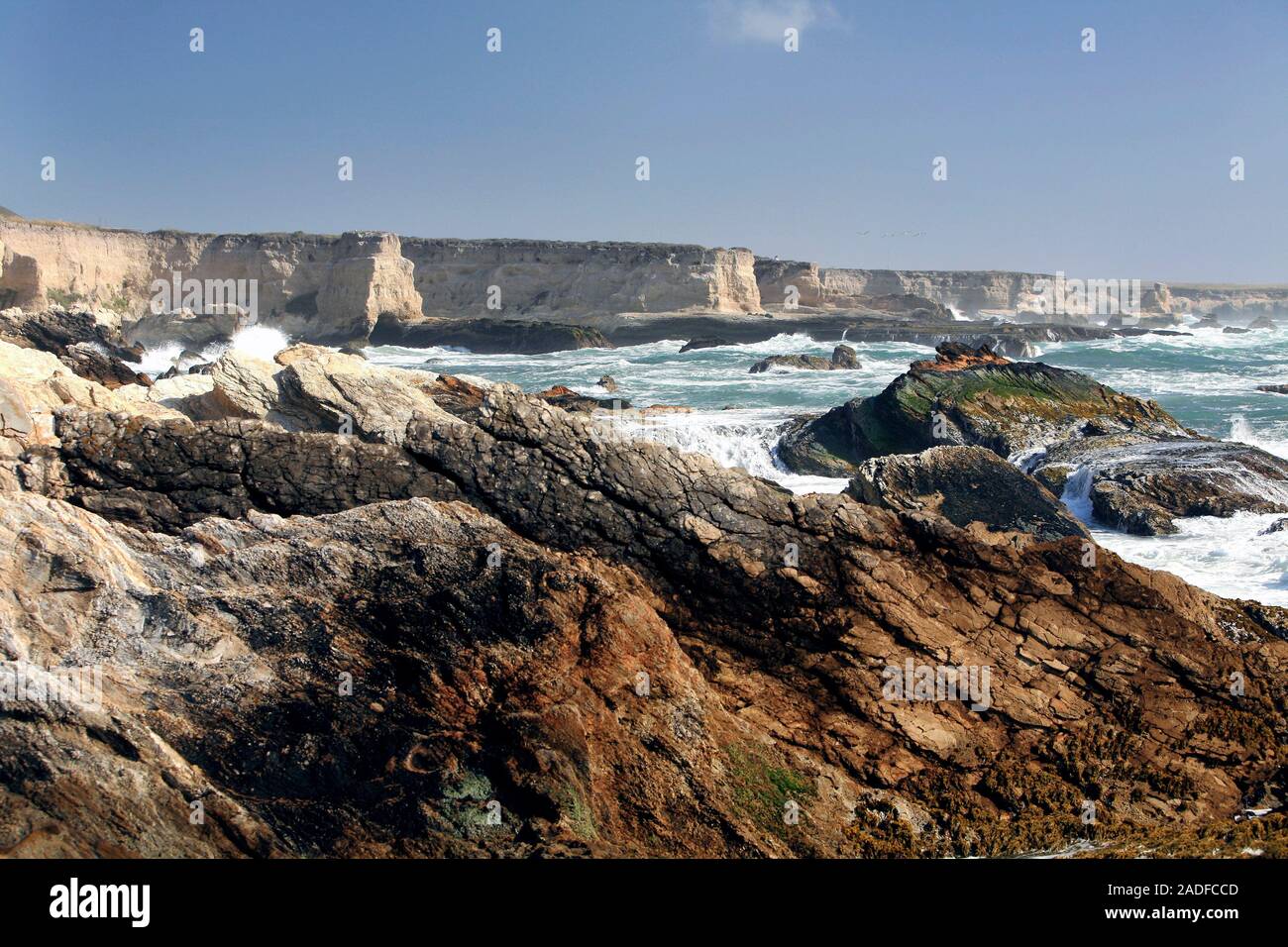 Limestone cliffs. These cliffs were formed by uplift where the Pacific ...