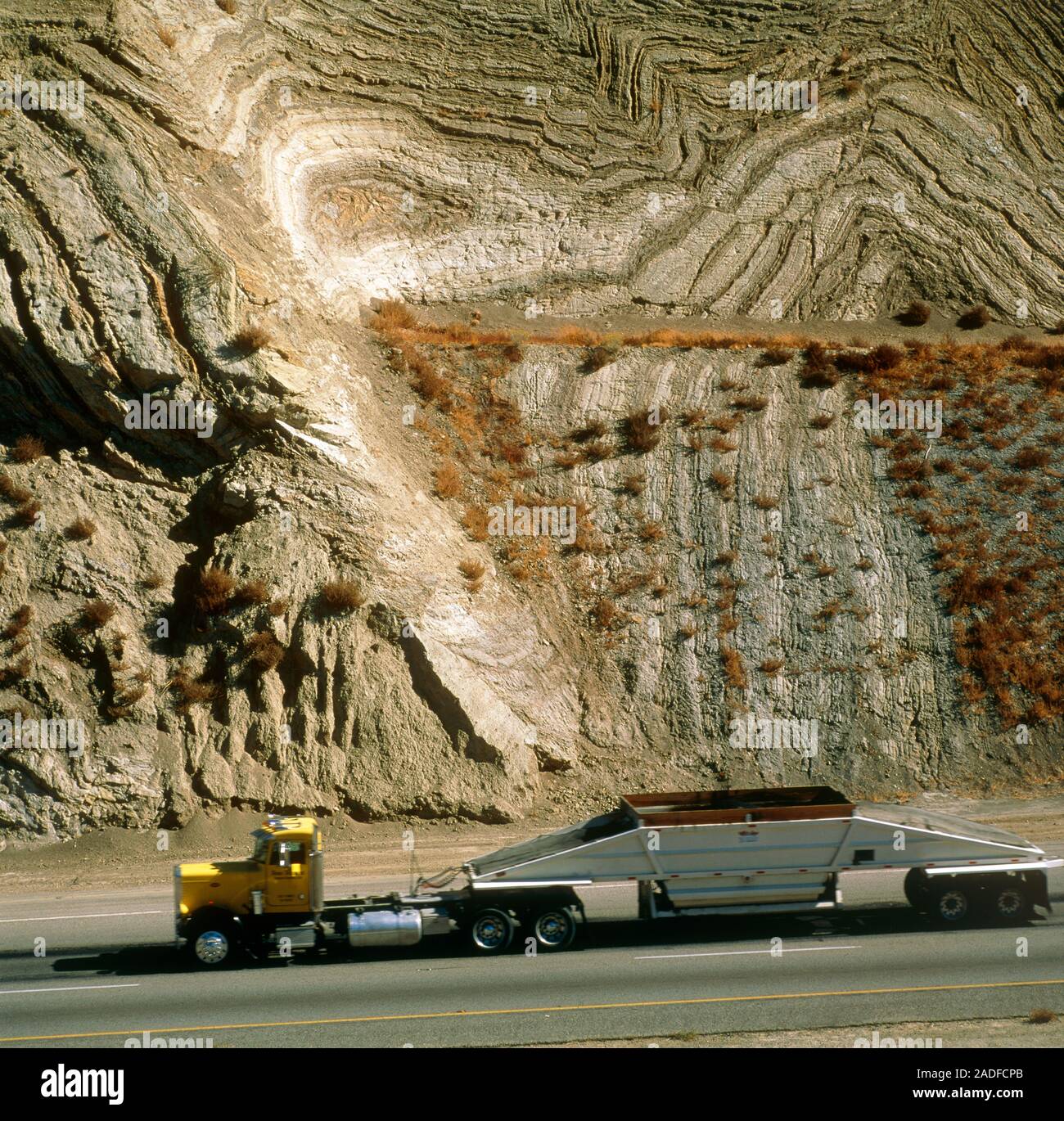 San Andreas fault. Folded rock strata exposed in a roadside cliff ...