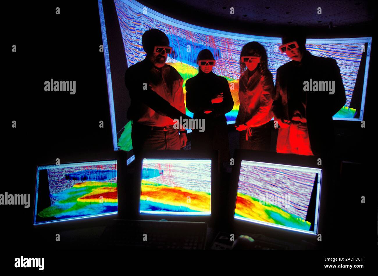 Geologist studying GeoProbe model. They are wearing glasses to make the ...