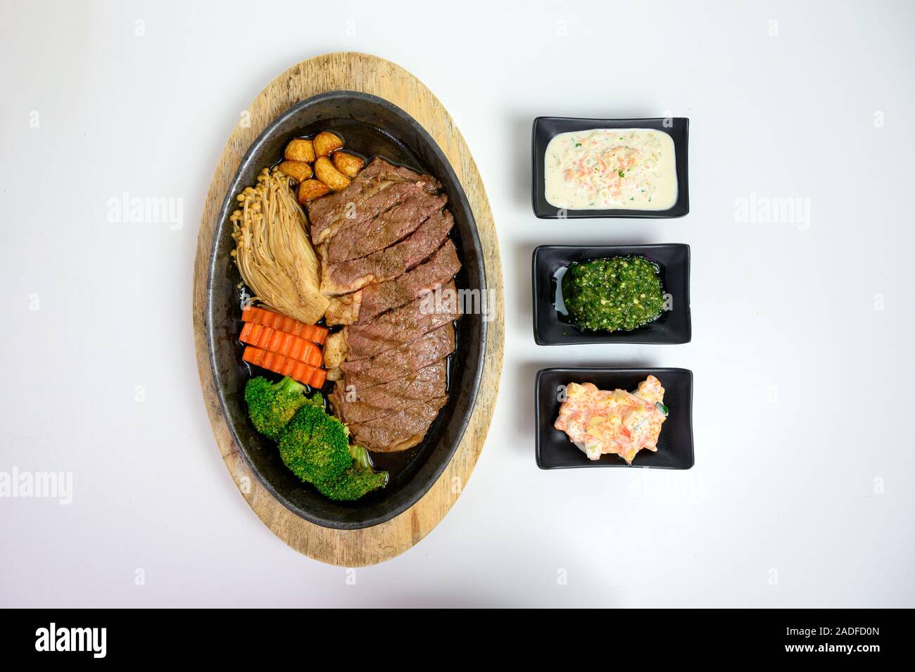 Japanese wagyu beef slices set with vegetables and sauce in pan on ...