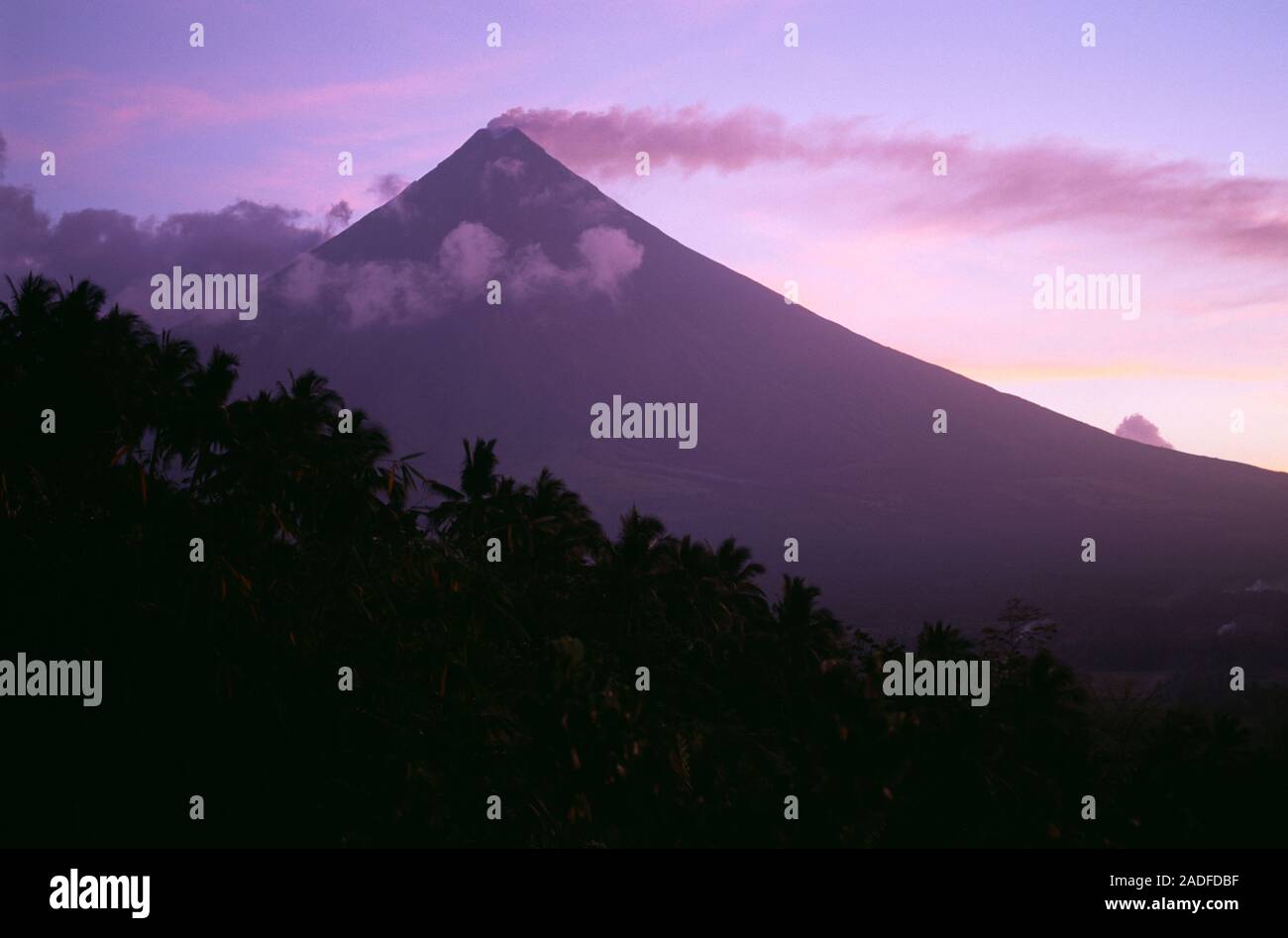Mayon volcano behind Lignon Hill, a forested parasitic cone on the ...