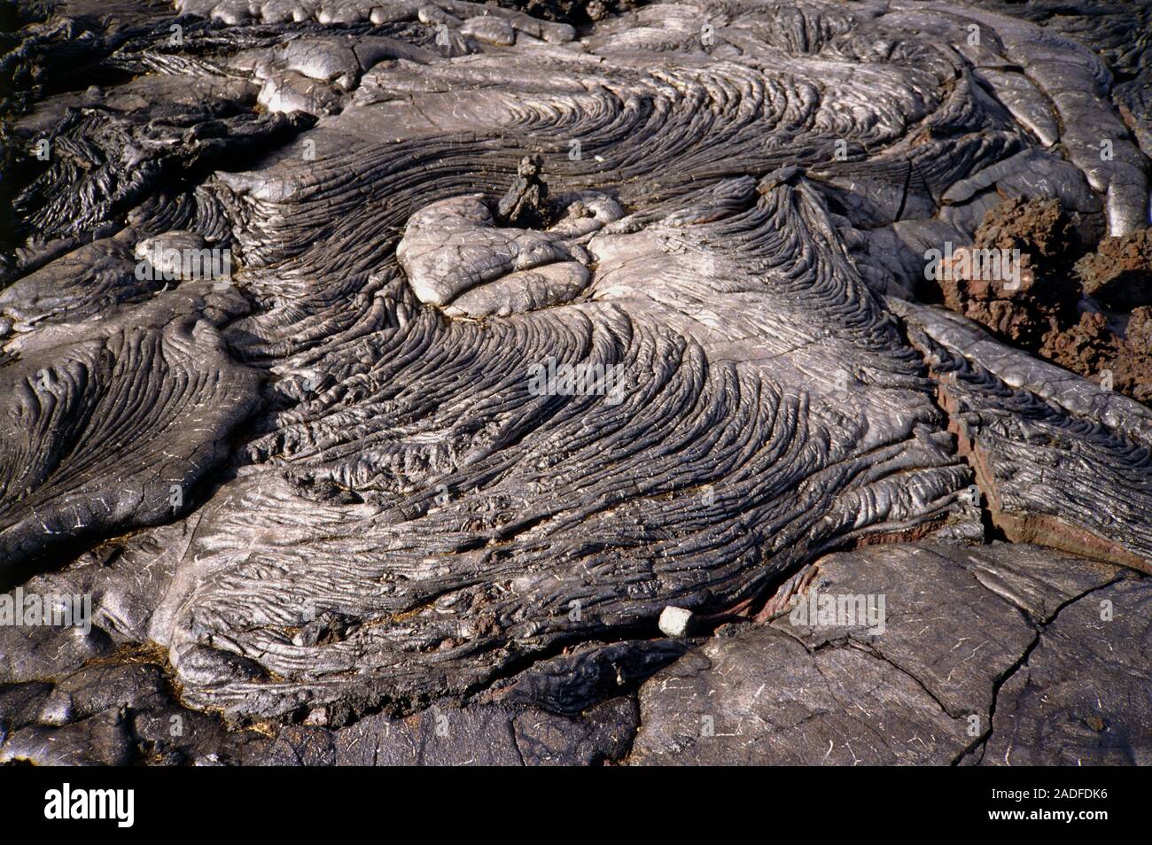 Patterns in cooled pahoehoe lava from a Hawaiian volcano. This type of ...