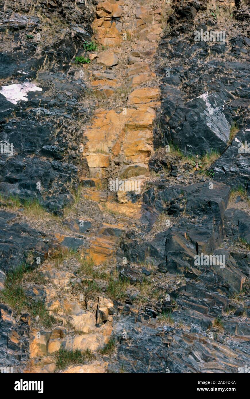 Tertiary volcanic intrusion called a dyke. A dyke is a sheet of rock ...