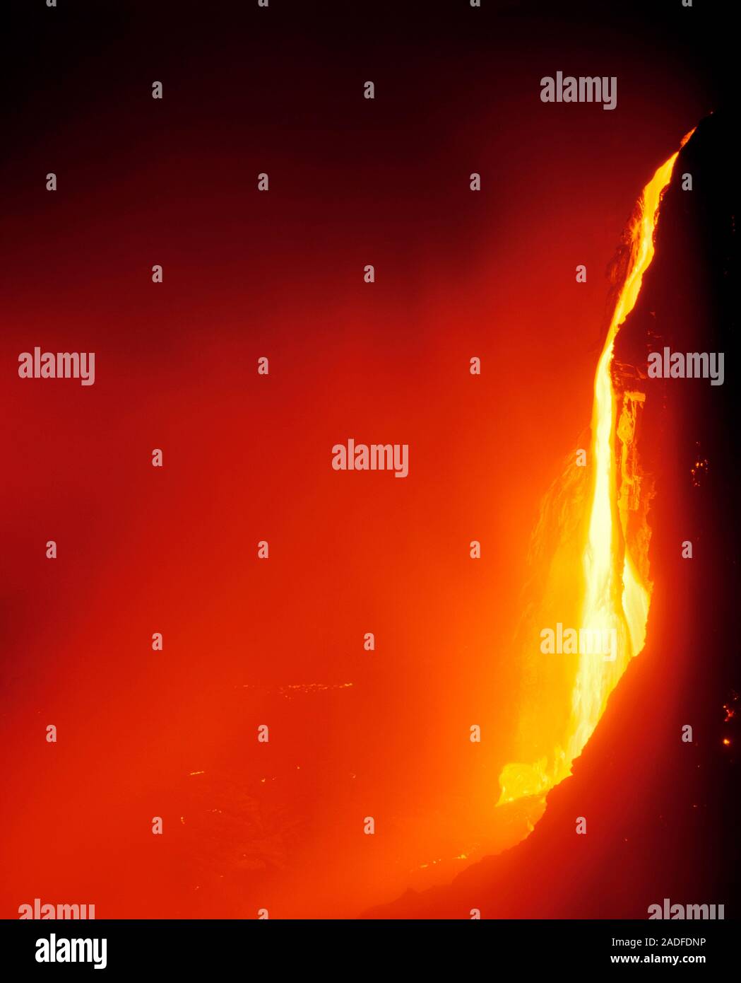 Pahoehoe lava. Steam rising as a flow of pahoehoe lava from Kilauea ...