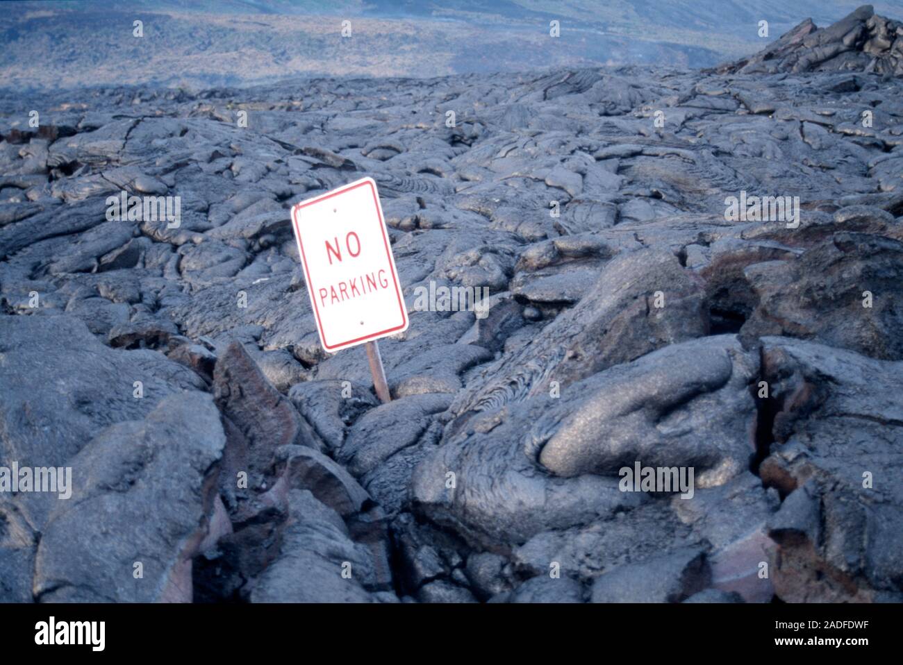 Cooled pahoehoe lava. The no parking" sign was originally at the side ...