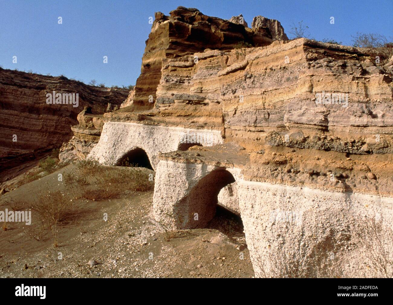 Volcanic rock strata formed from successive layers of volcanic ash ...