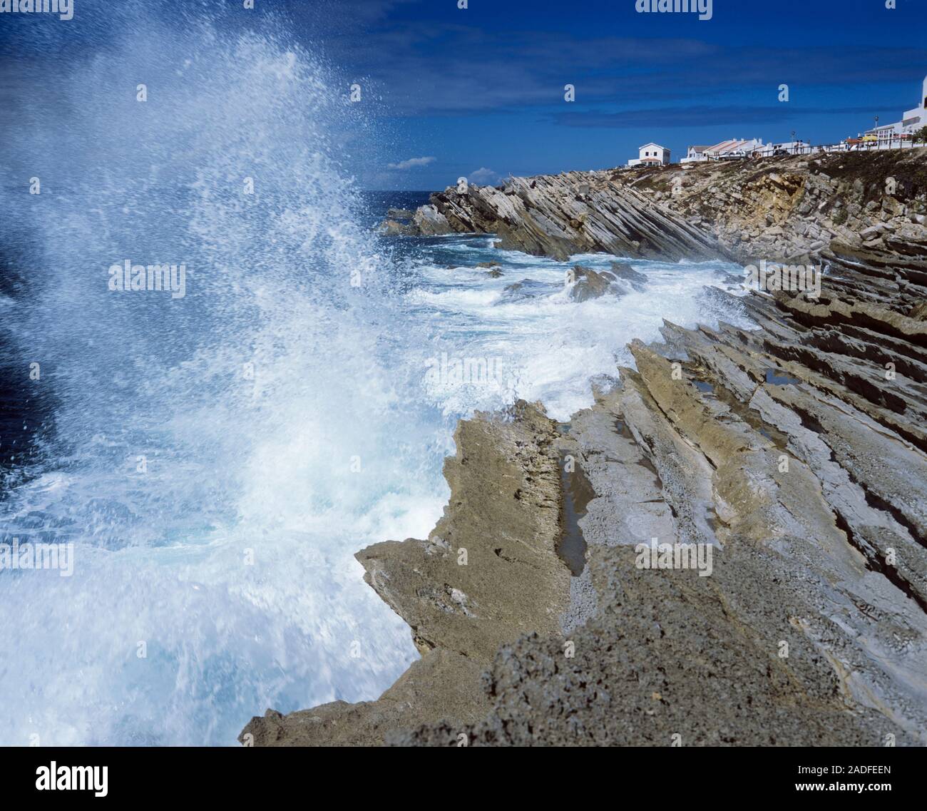 Rock strata revealed in eroded coastal rocks. The diagonal strata seen ...