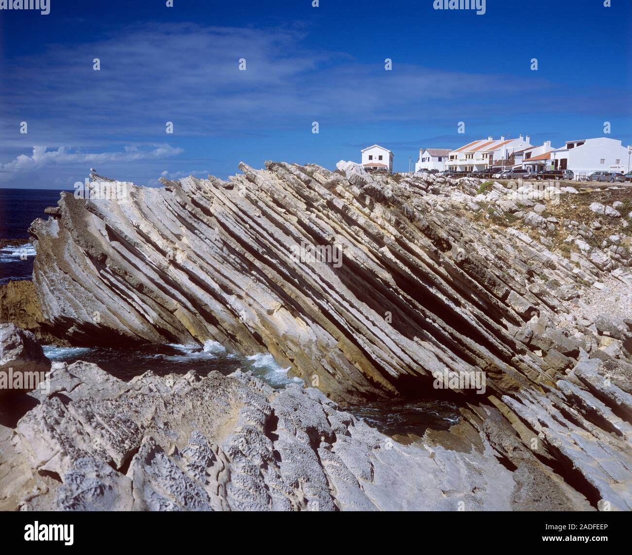Rock strata revealed in eroded coastal rocks. The diagonal strata seen ...