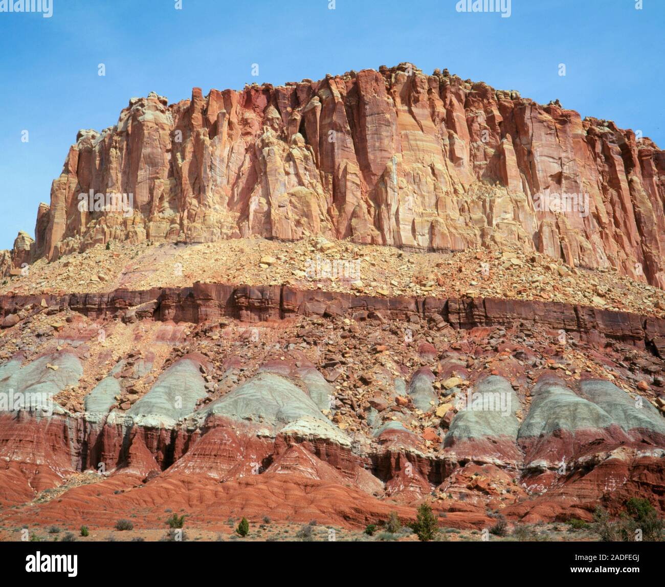 Banded sedimentary cliff. View of a cliff of sedimentary rocks, showing ...