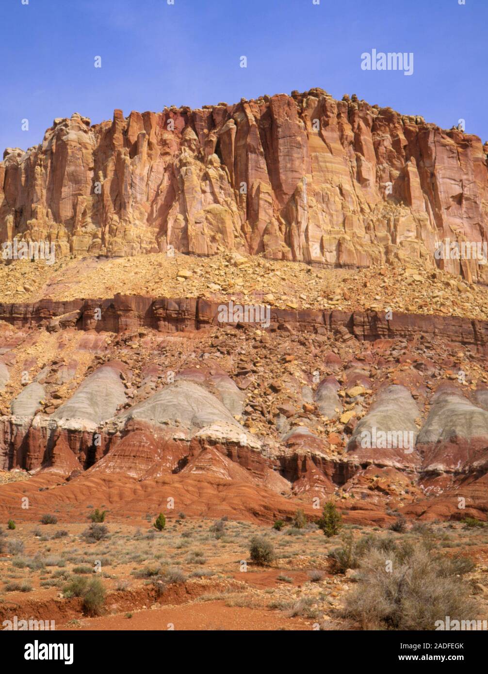 Banded sedimentary cliff. View of a cliff of sedimentary rocks, showing ...
