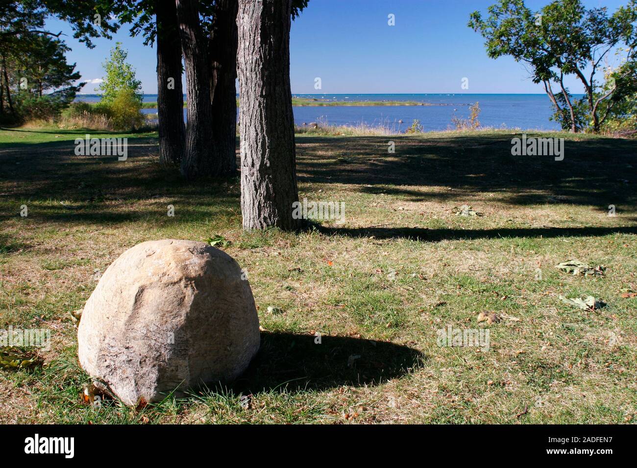 Calcite rock concretion. This round rock (lower left) formed as the ...