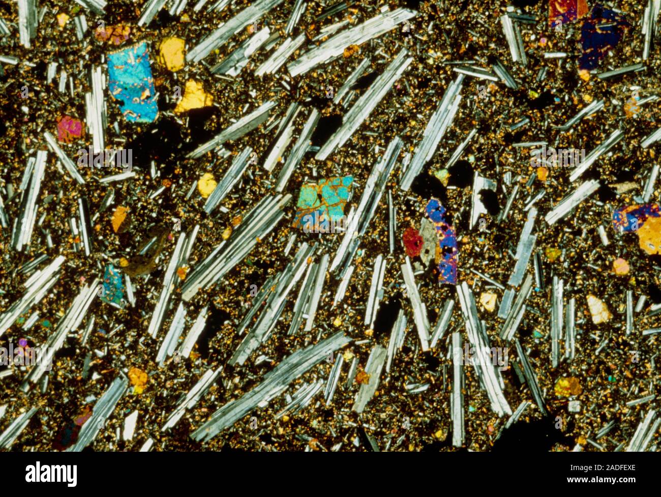 Cross polarised light micrograph of a thin section of a porphyritic ...