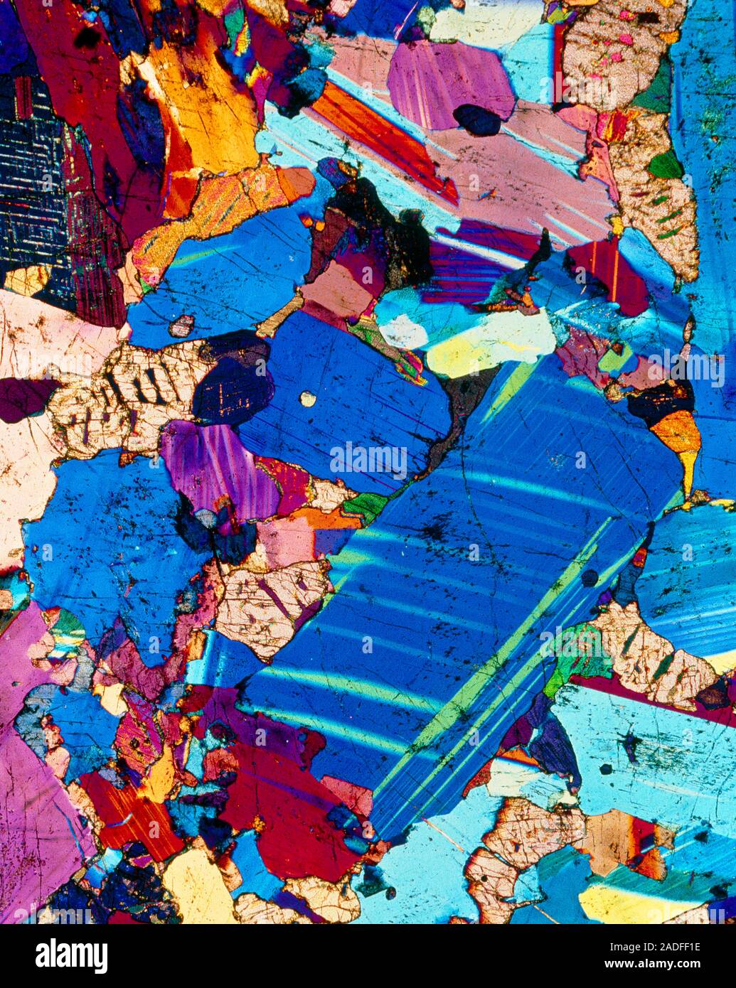 Gabbro. Polarised light micrograph of a thin section of gabbro, an igneous rock. Gabbro is ...