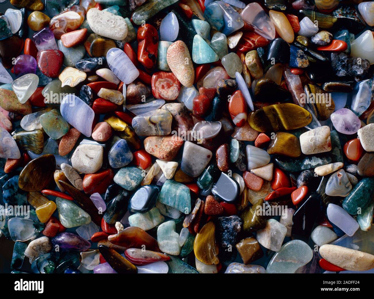 Pebbles. A collection of smooth, coloured pebbles. Most of these ...