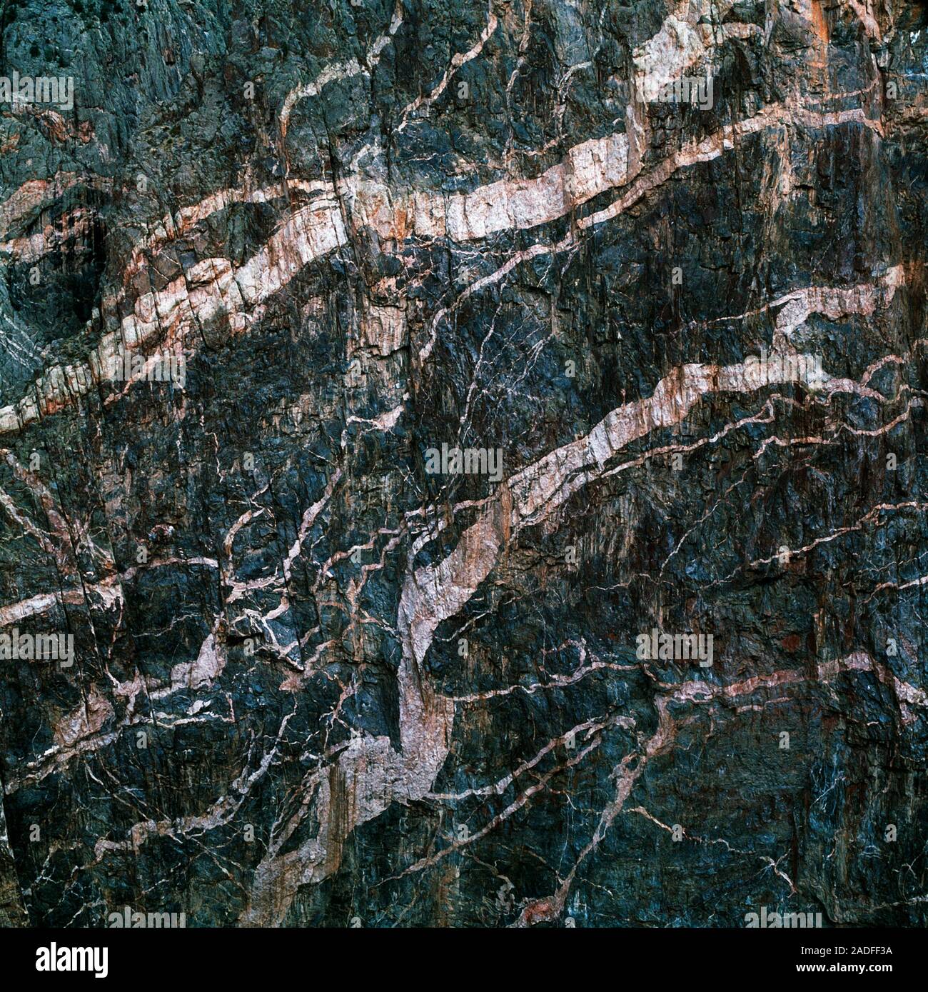 Banding patterns in a wall of igneous rock. These bands were formed ...