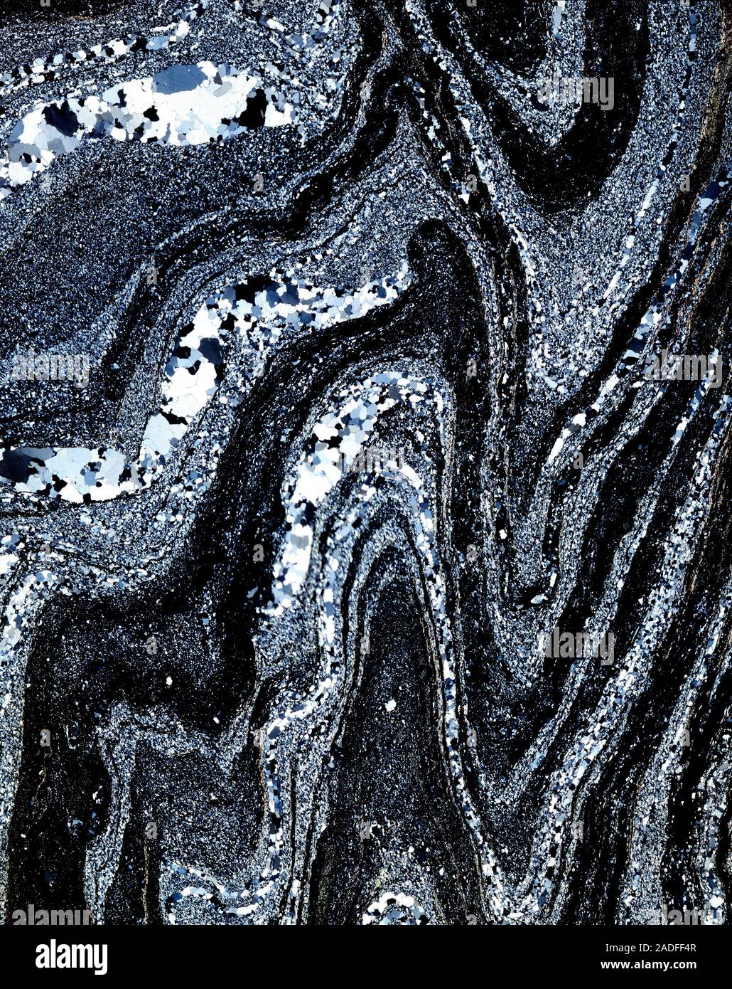 Microfolds in graphite schist. Light micrograph of banded layers of ...