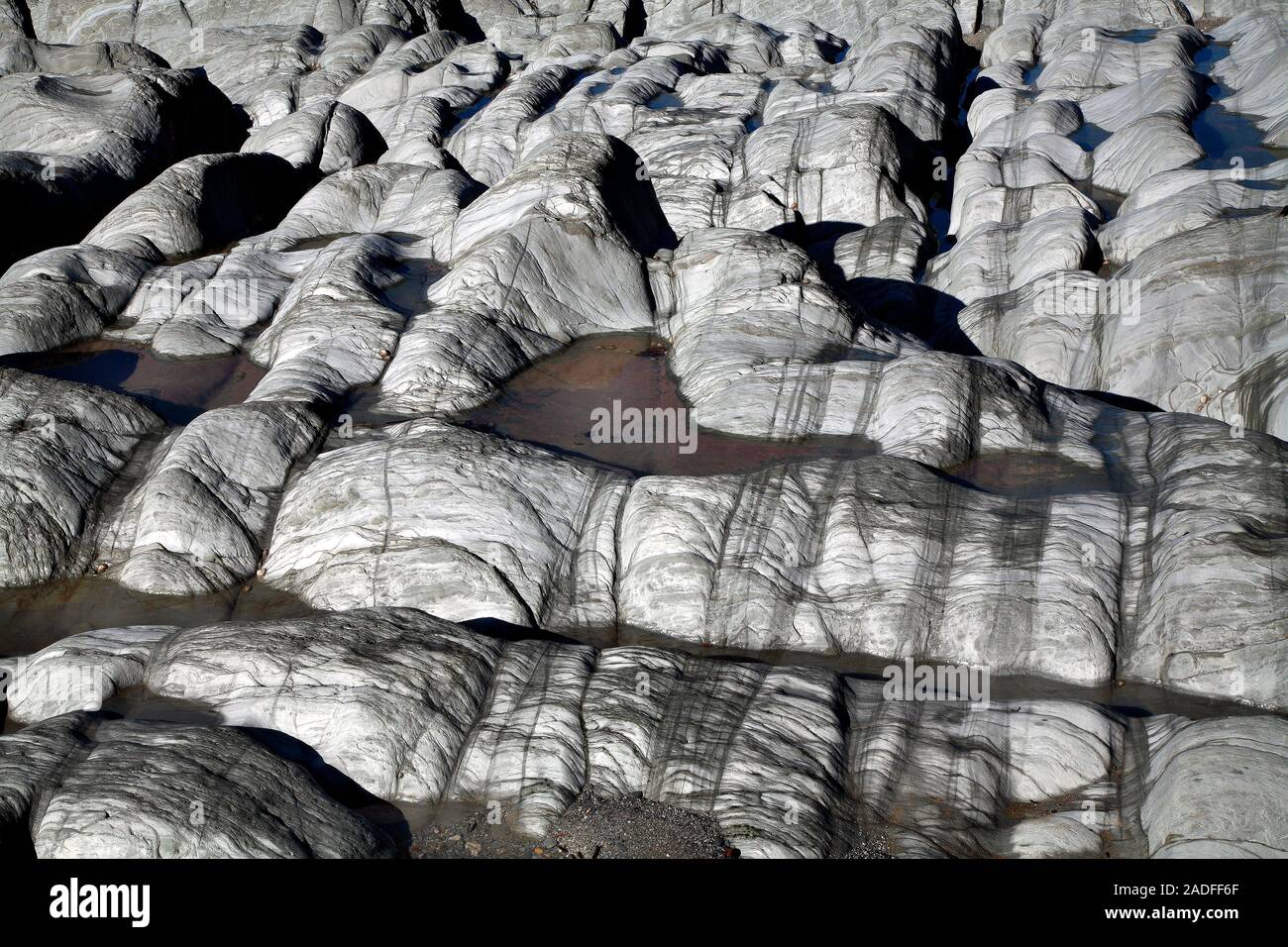 Common shale bedrock on the coast. This shale has been worn smooth by ...