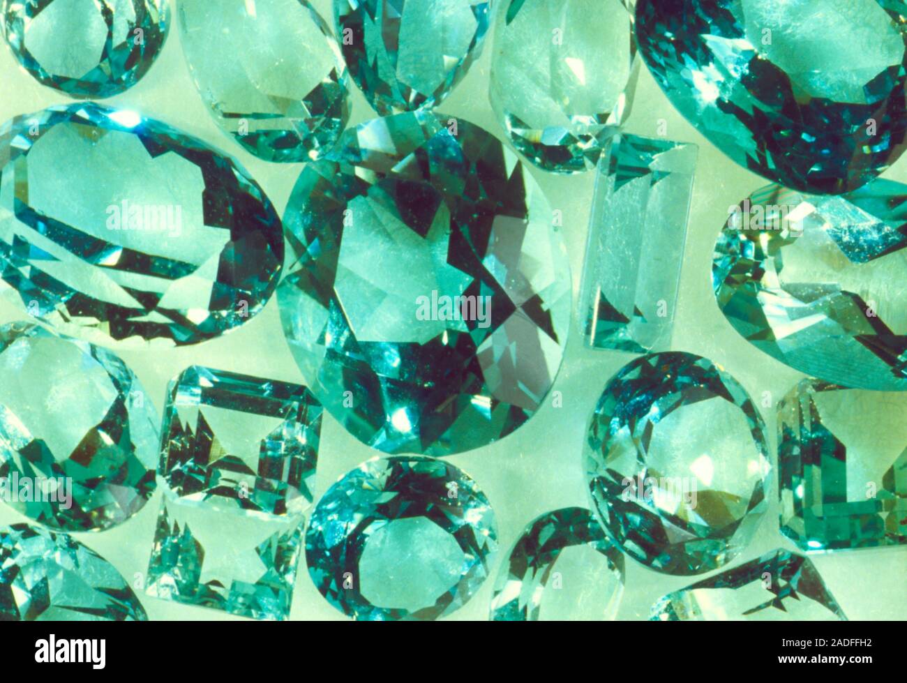 Cut crystals of aquamarine, a transparent blue variety of beryl ...
