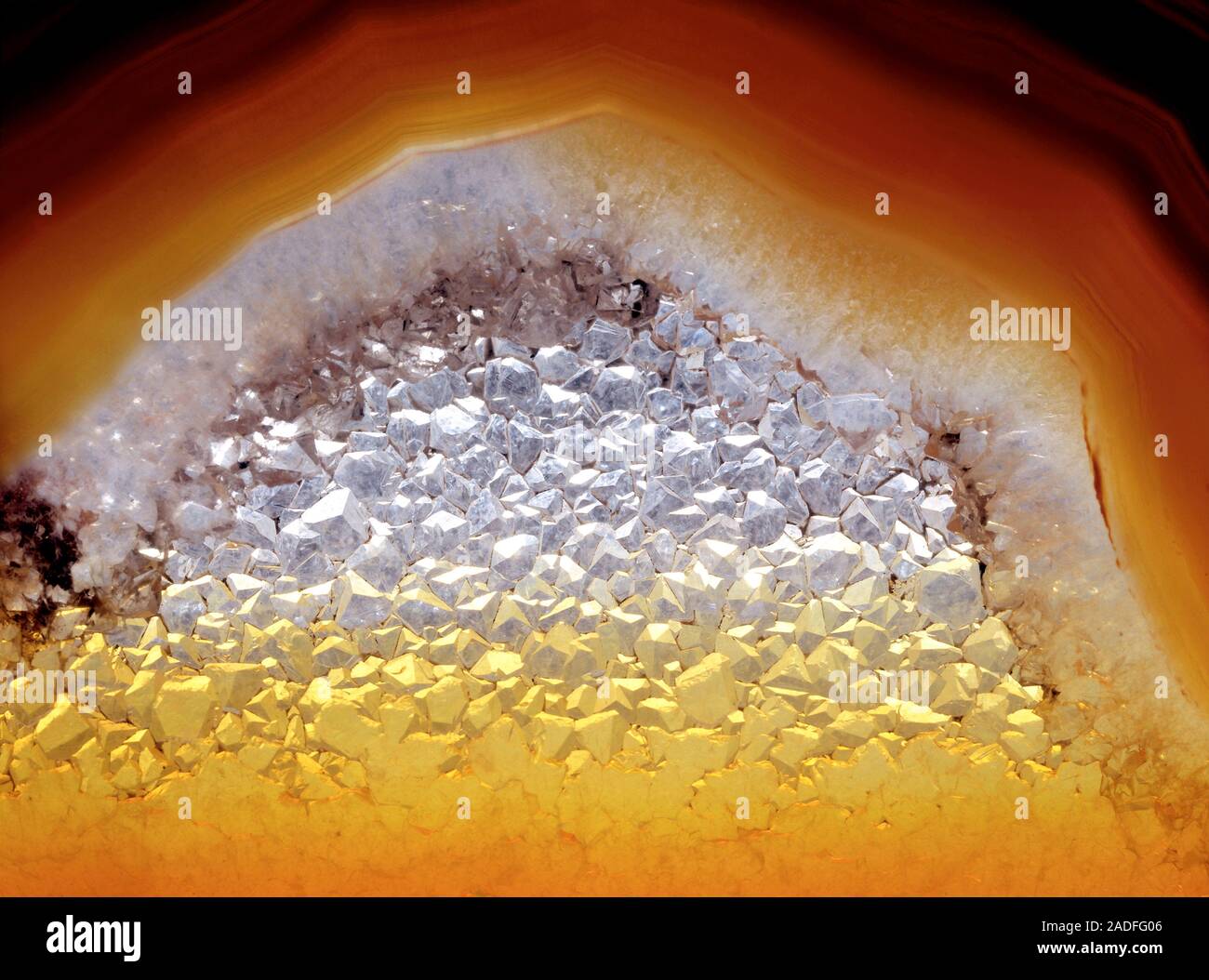 Geode interior. Quartz crystals (centre) inside a geode. A geode forms ...