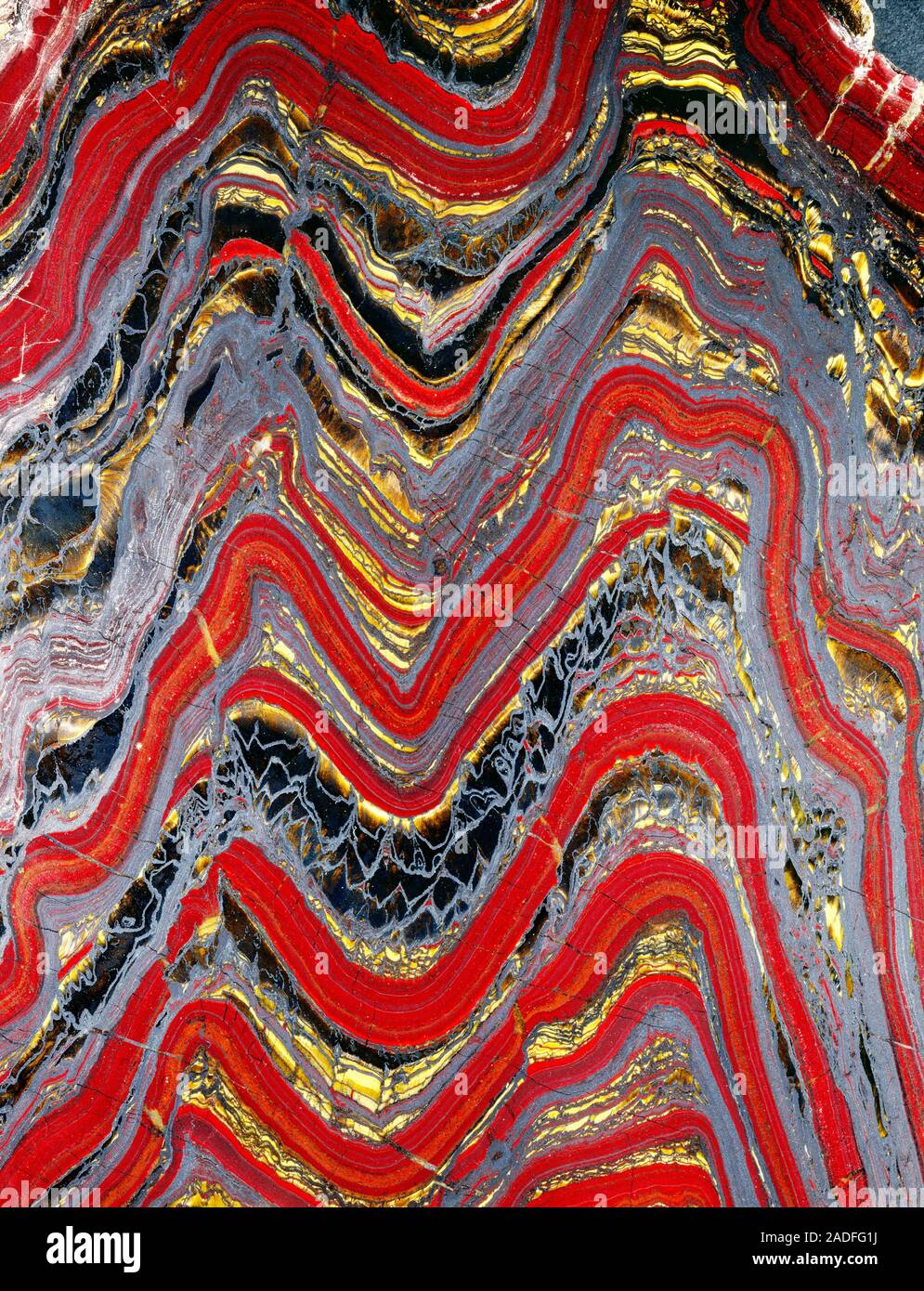 Banded iron formation. Folded layers of a banded iron formation (BIF or ...