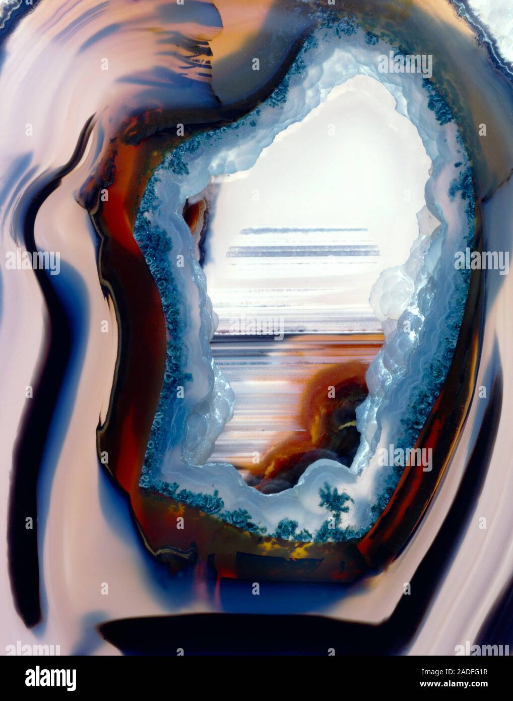 Geode interior. Thin slice of a geode showing the layers of silica ...