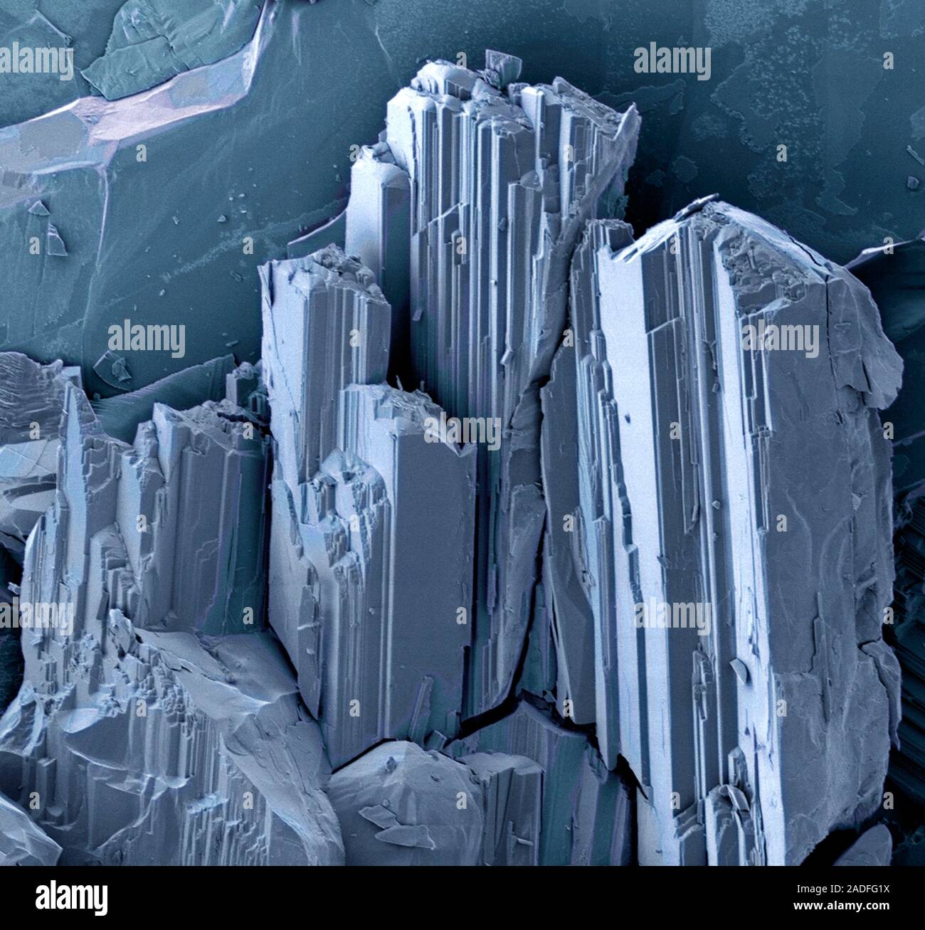 Black tourmaline. Coloured scanning electron micrograph (SEM) of a ...