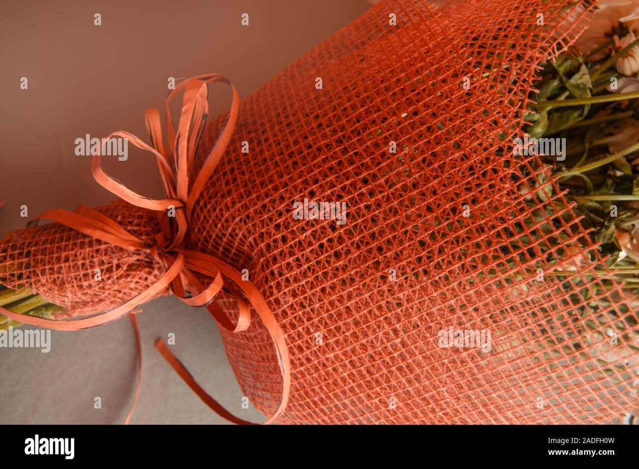Bouquet of flowers Packed in red mesh for floristry, close-up, open ...