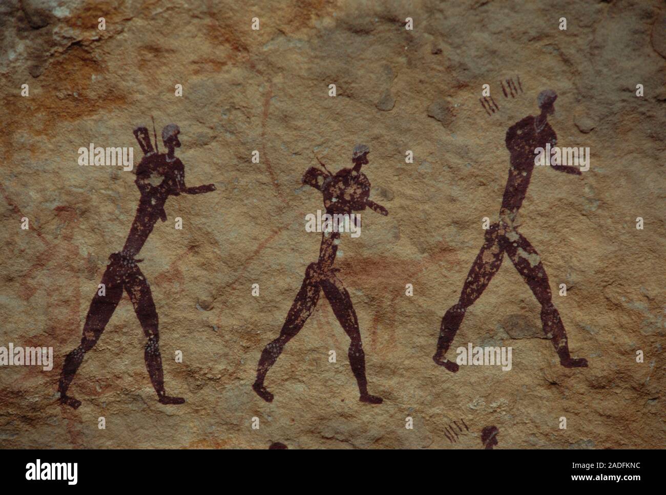 San rock art depicting hunters marching. The San people (also known as ...