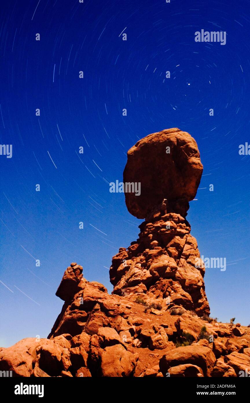 Eroded rock pillar. Star trails above the Balanced Rock sandstone ...