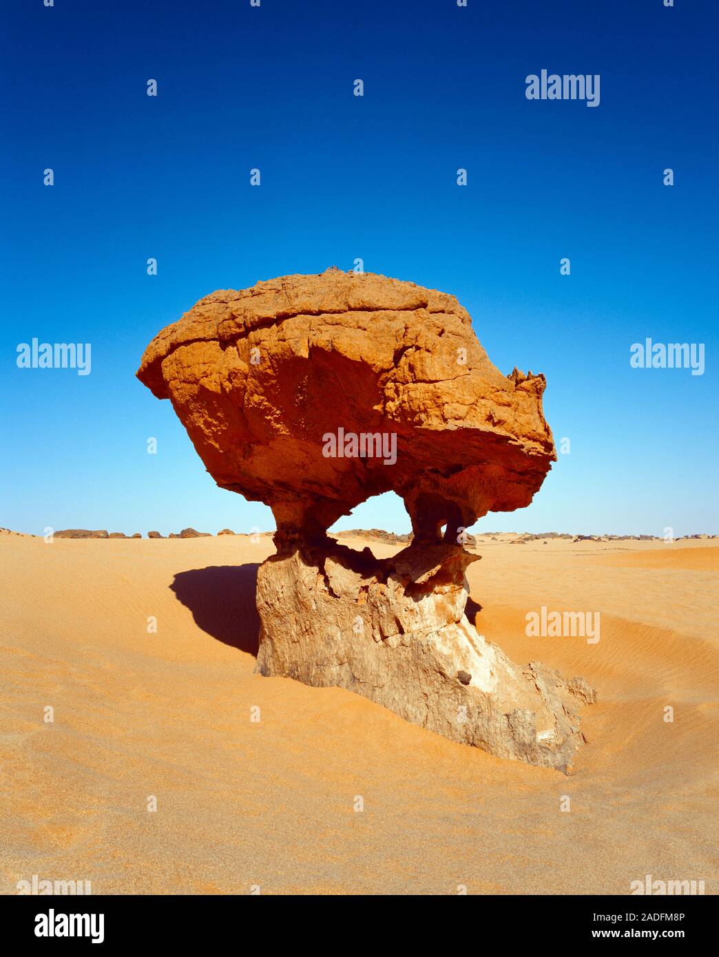 Eroded sandstone column in a desert. Wind intensity increases around ...