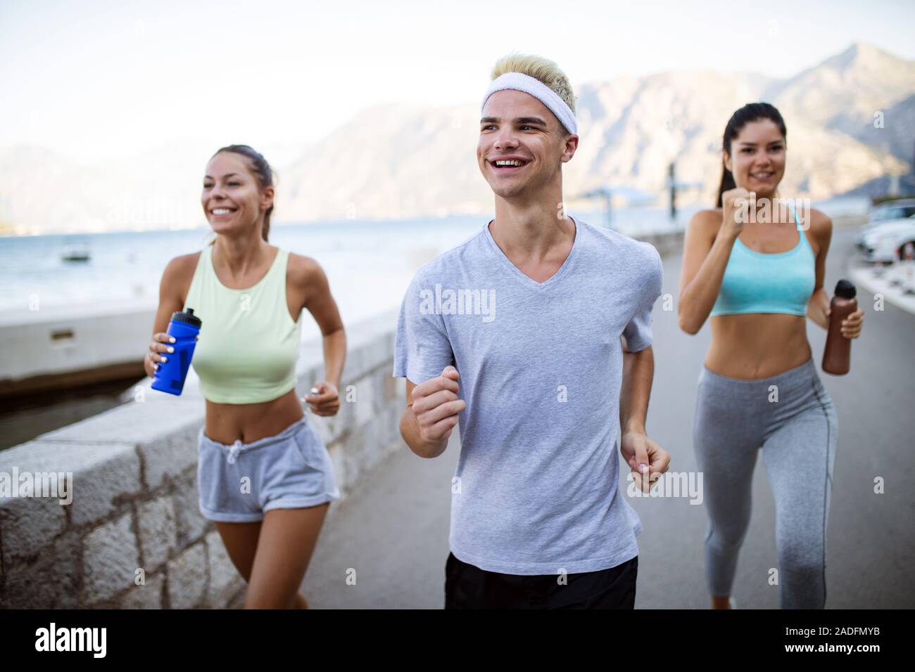 Group of young people jogging and running outdoors in nature Stock ...