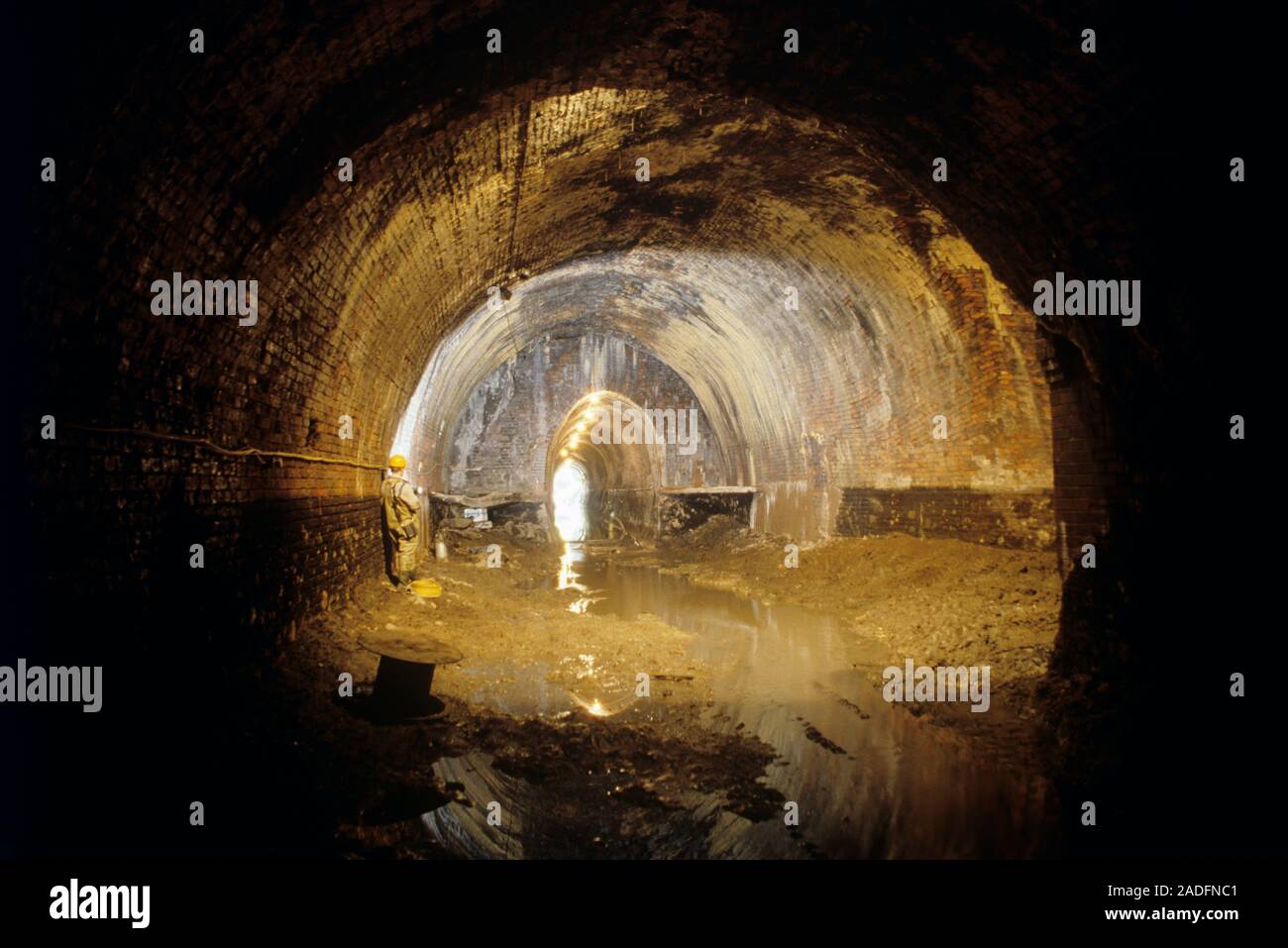 Drained canal under a bricked tunnel at Wren's Nest Limestone Quarry ...