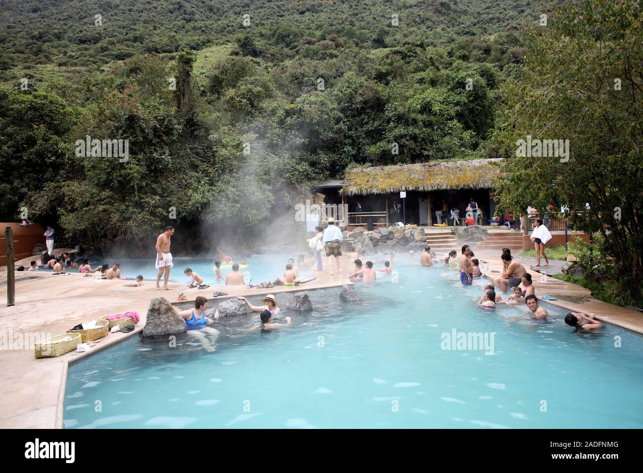Geothermal pool. Tourists relaxing in a geothermal pool. Geothermal ...