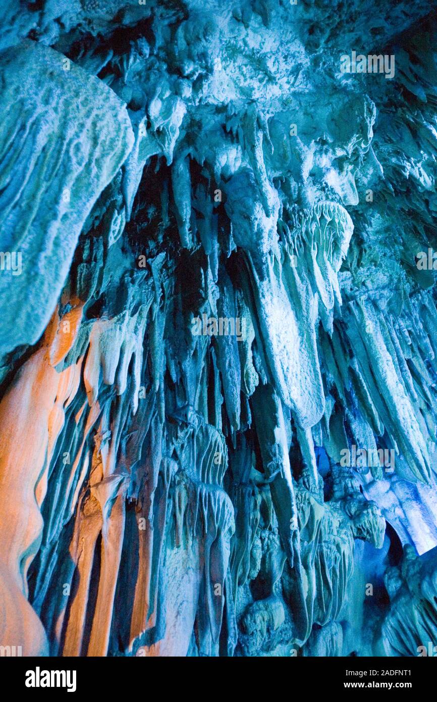Reed flute cave. Stalactites on the ceiling of a cave. These cave ...