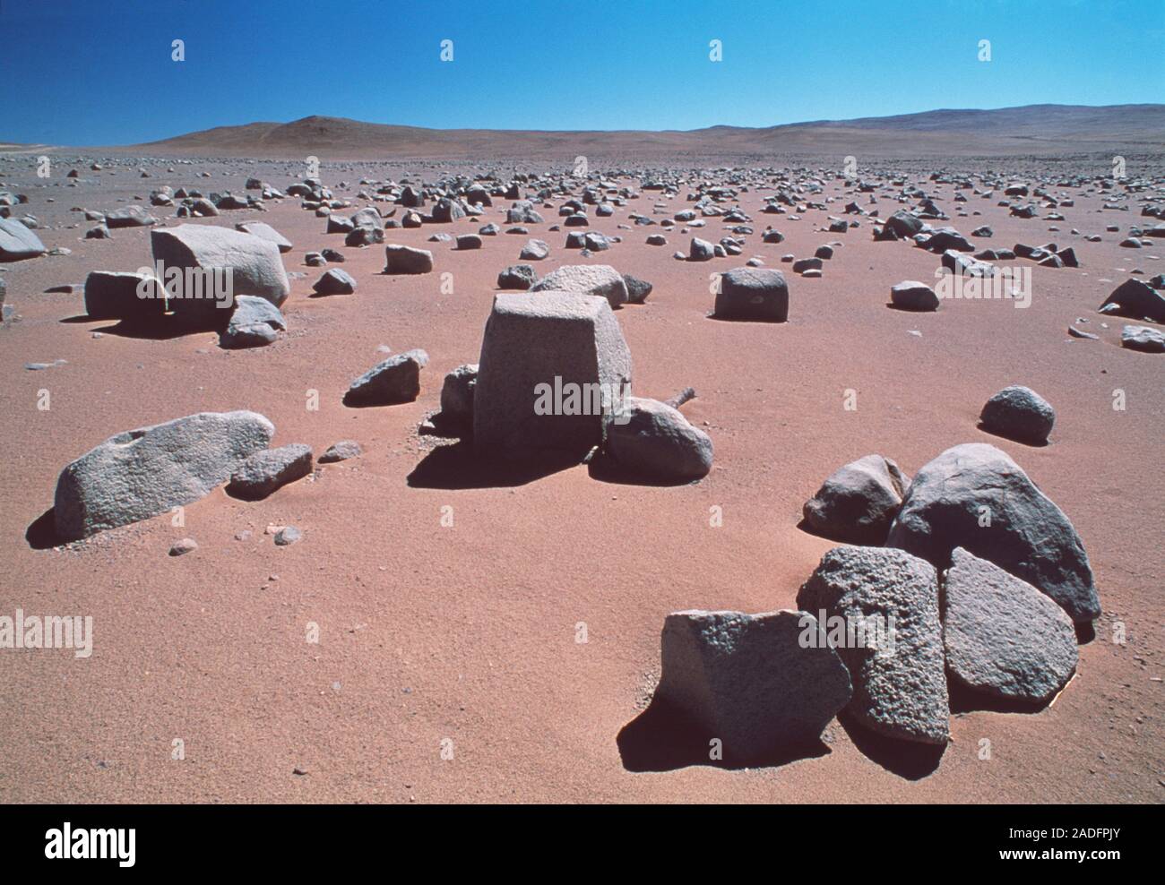 Atacama desert. Boulders strewn across a plain in the Atacama desert of ...