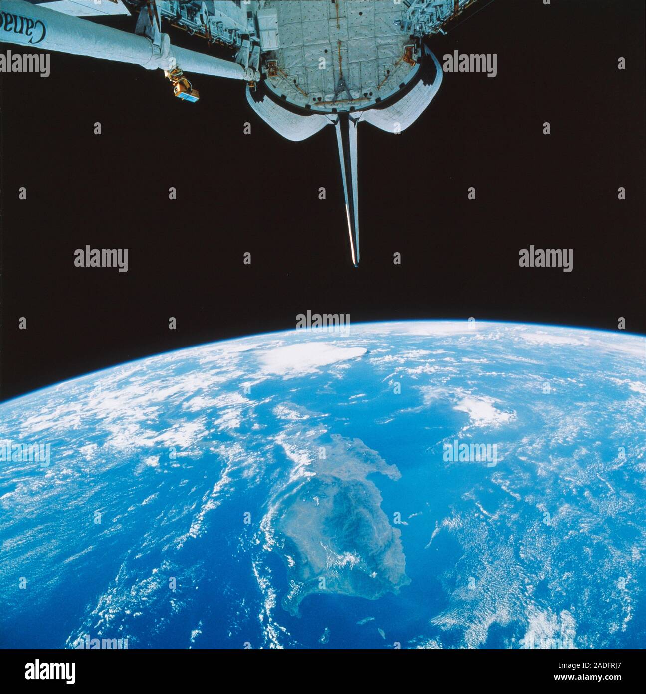 The space shuttle Discovery in orbit over the island of Luzon in the ...