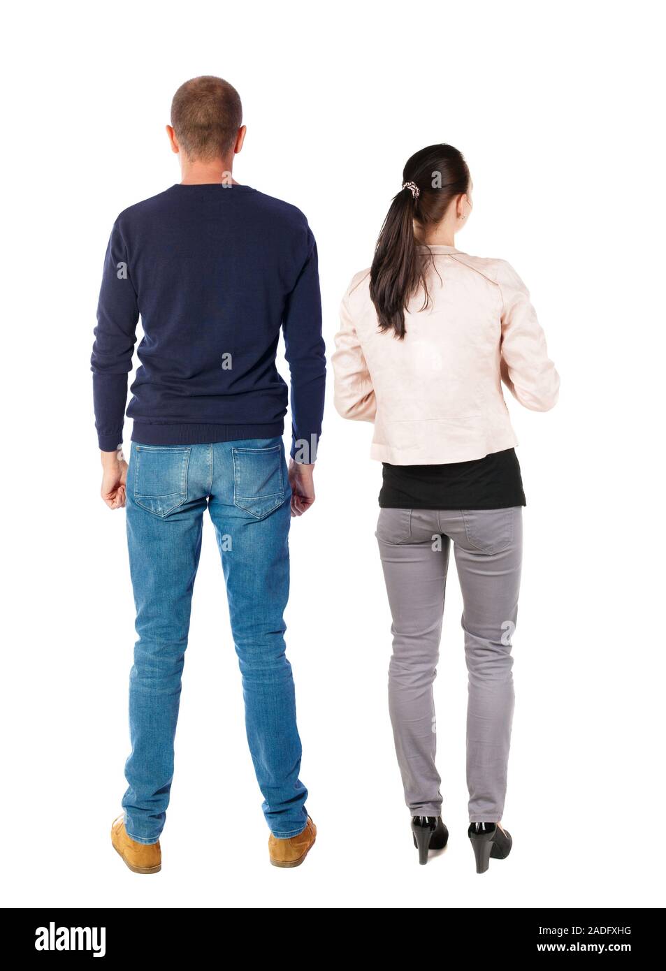 Back view of couple. beautiful friendly girl and guy together. Rear ...