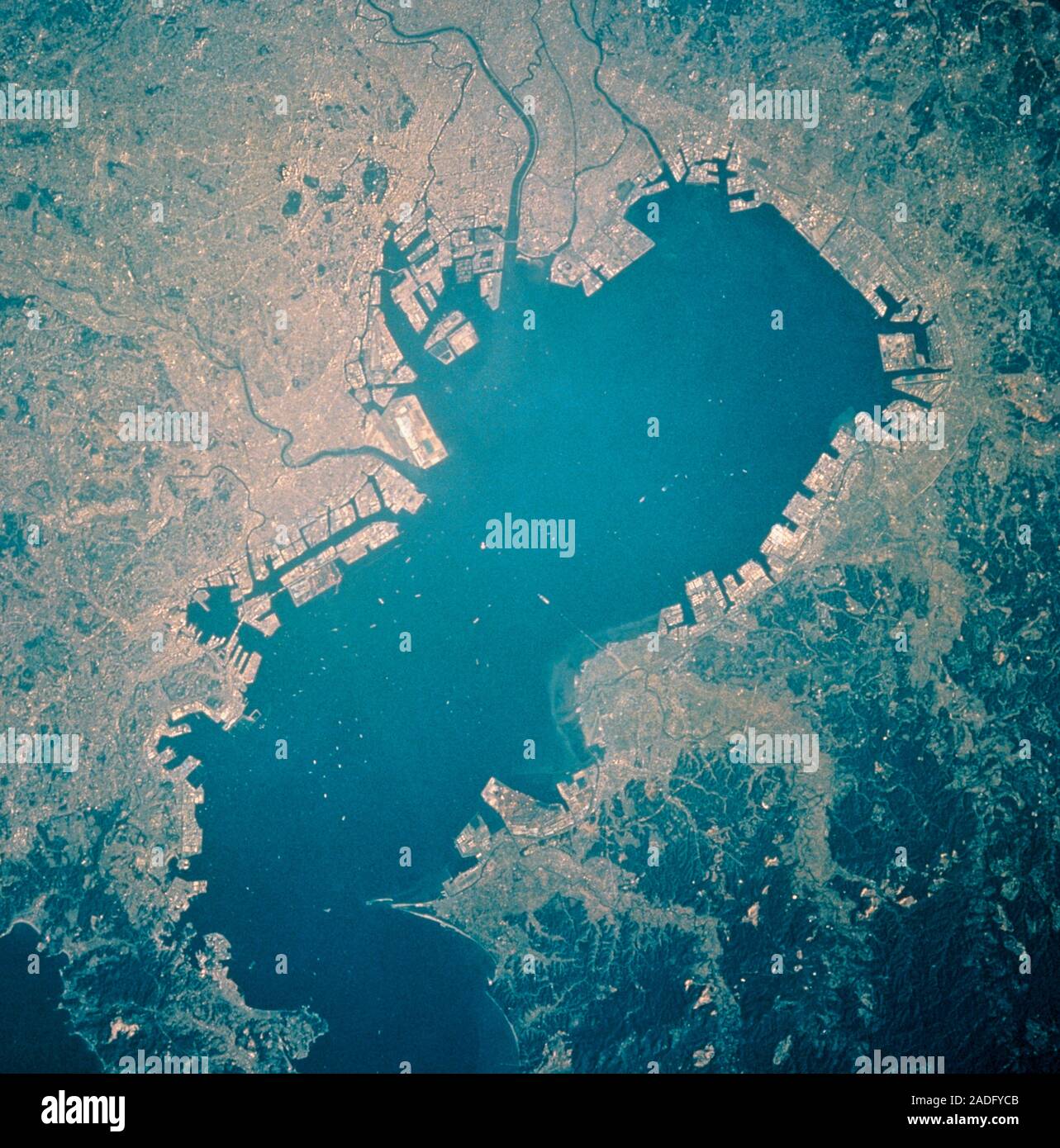 Tokyo Bay seen from space. Tokyo city is at the top of the frame. On ...