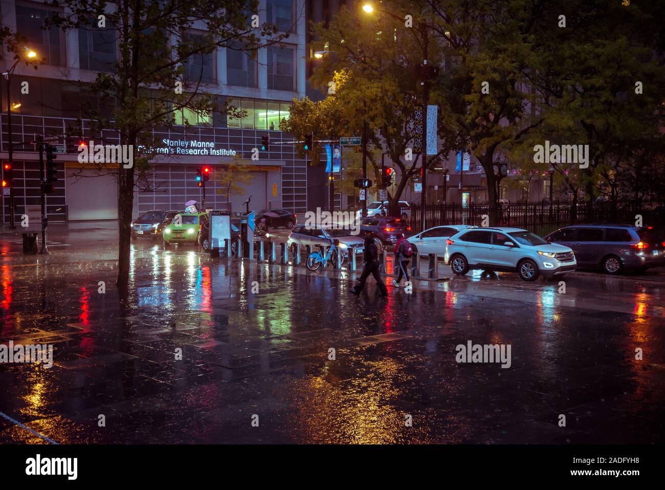 Downtown traffic at night in the rain, Chicago, Illinois, USA Stock ...