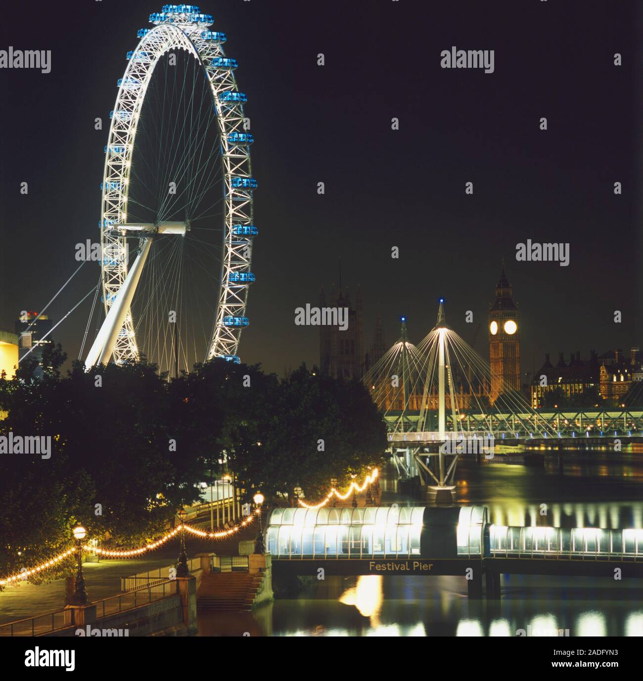 London Eye, London, UK, at night. This enormous structure (left ...