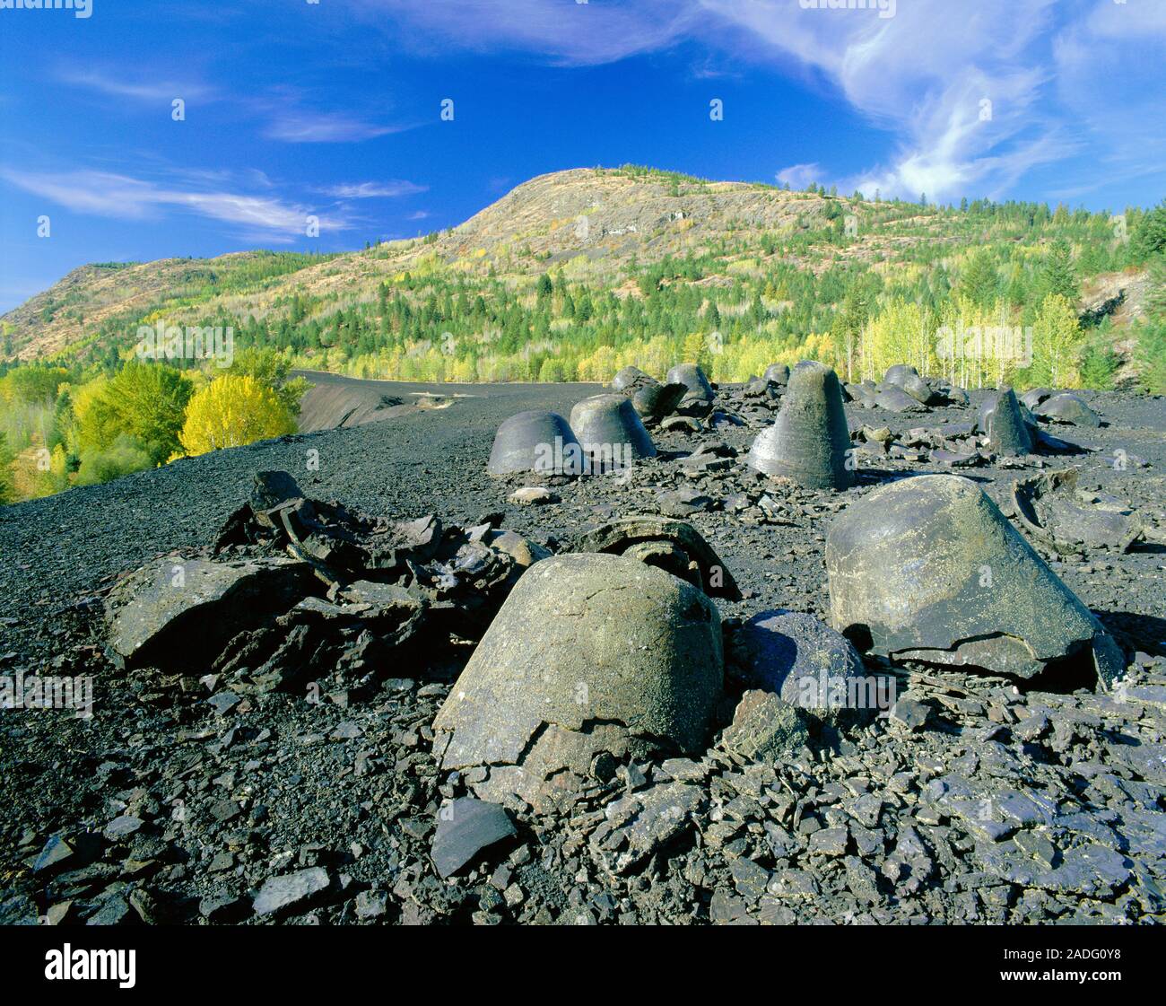 Slag heap. Discarded slag or scoria, the residue left after smelting a ...