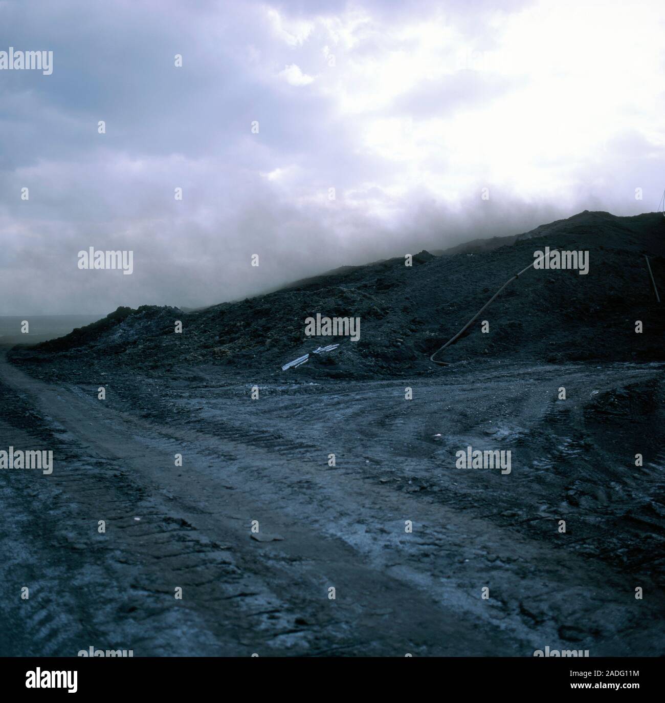 Fly-ash. Dust blowing off piles of fly-ash in strong winds. The tip ...