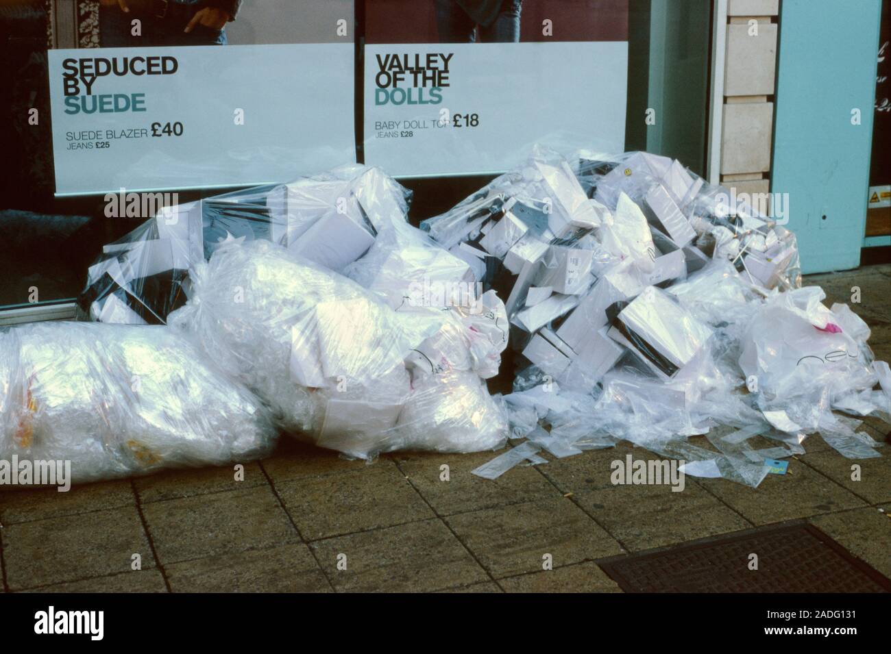 Packaging waste bundled into bags and dumped outside a shop ...