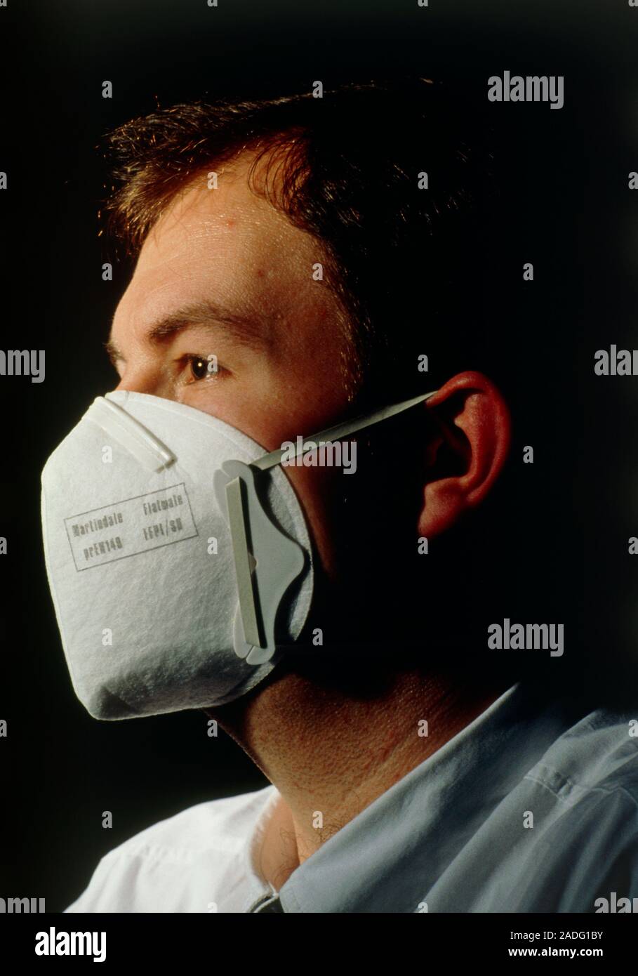 Air pollution mask. Man wearing a face mask to protect against air ...