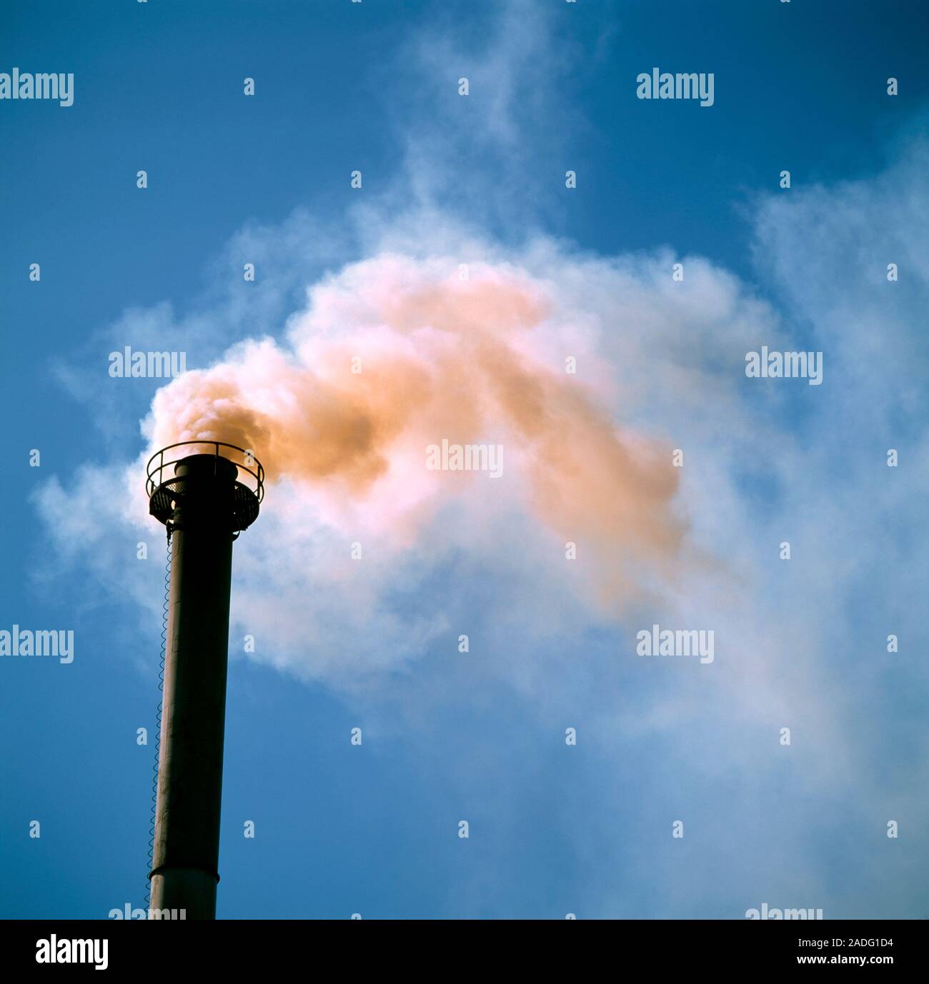 Industrial pollution. Sulphurous smoke pouring from a smokestack. Smoke ...