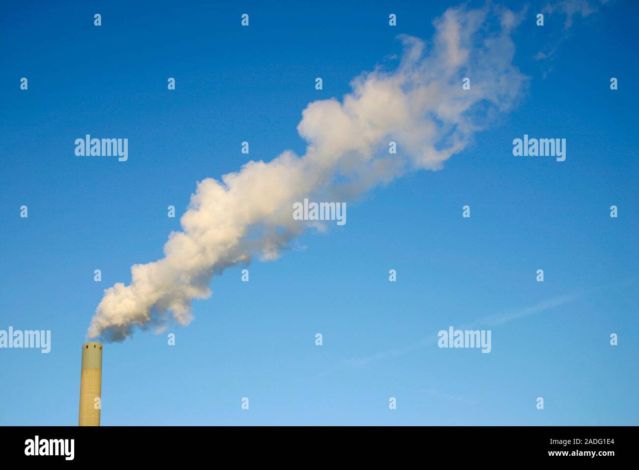 Chimney smoke rising into the air. Photographed in the Netherlands ...
